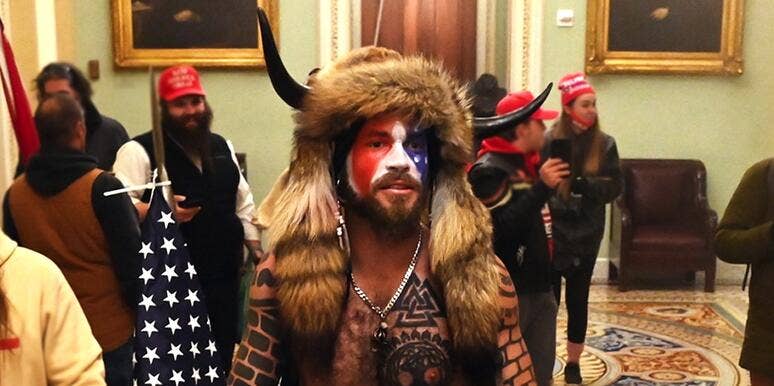 Who Is Jake Angeli Man In Headdress Who Stormed Us Capitol Identified As Far Right Qanon Shaman